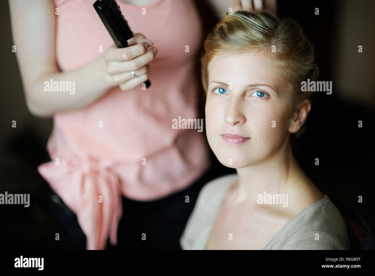Beautiful woman getting hair done hi-res stock photography and images ...