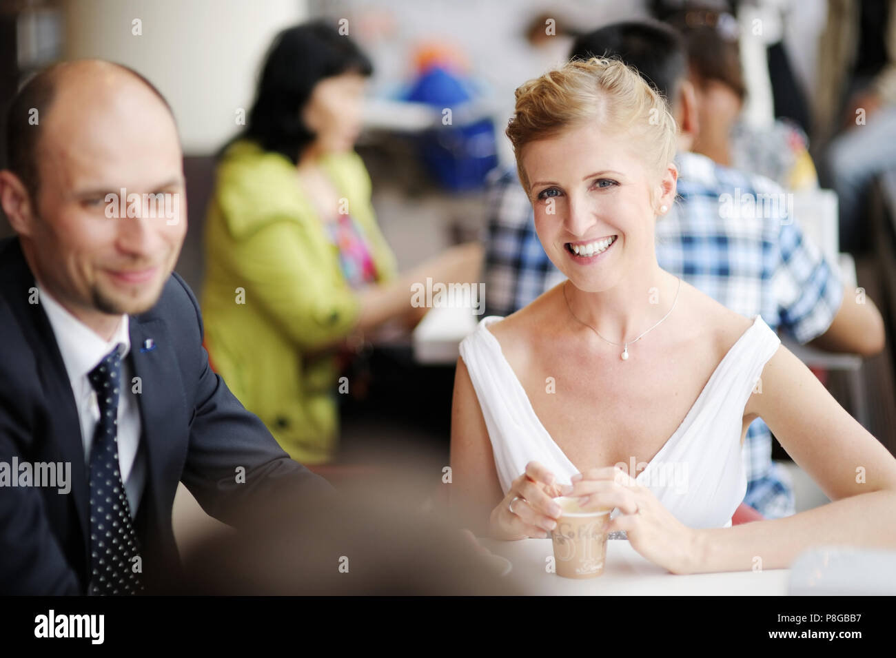 Bride drinking coffee at an outdoor cafe Stock Photo - Alamy