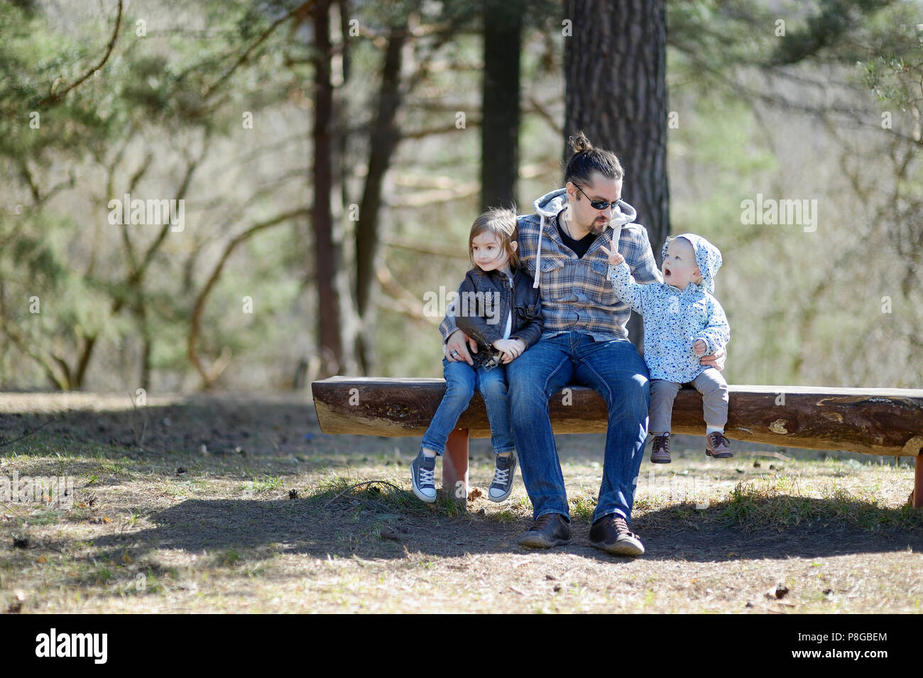 Young father and his two little daughters Stock Photo - Alamy