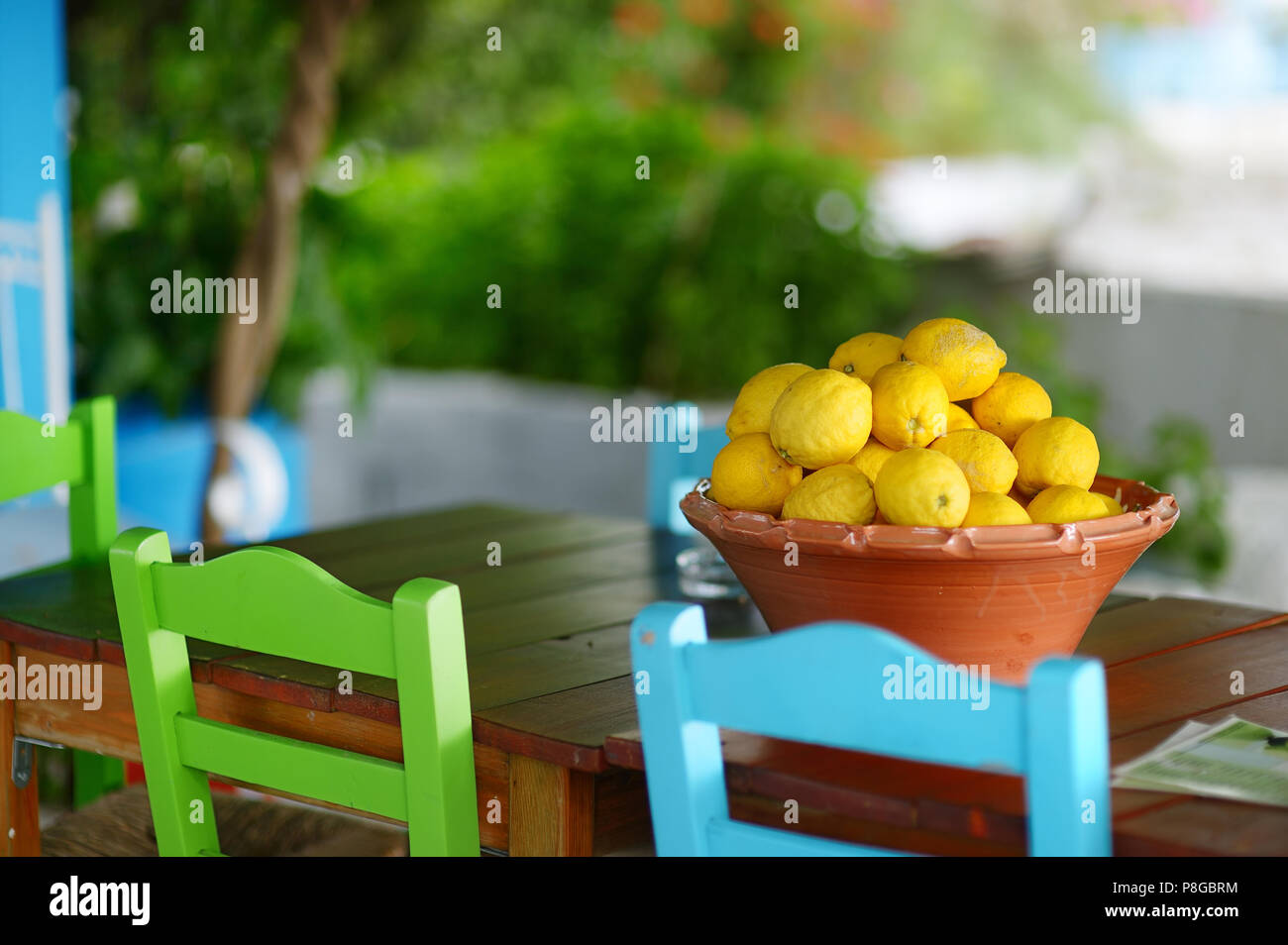 A dish of lemons in typical greek outdoor cafe on Kos island Stock ...