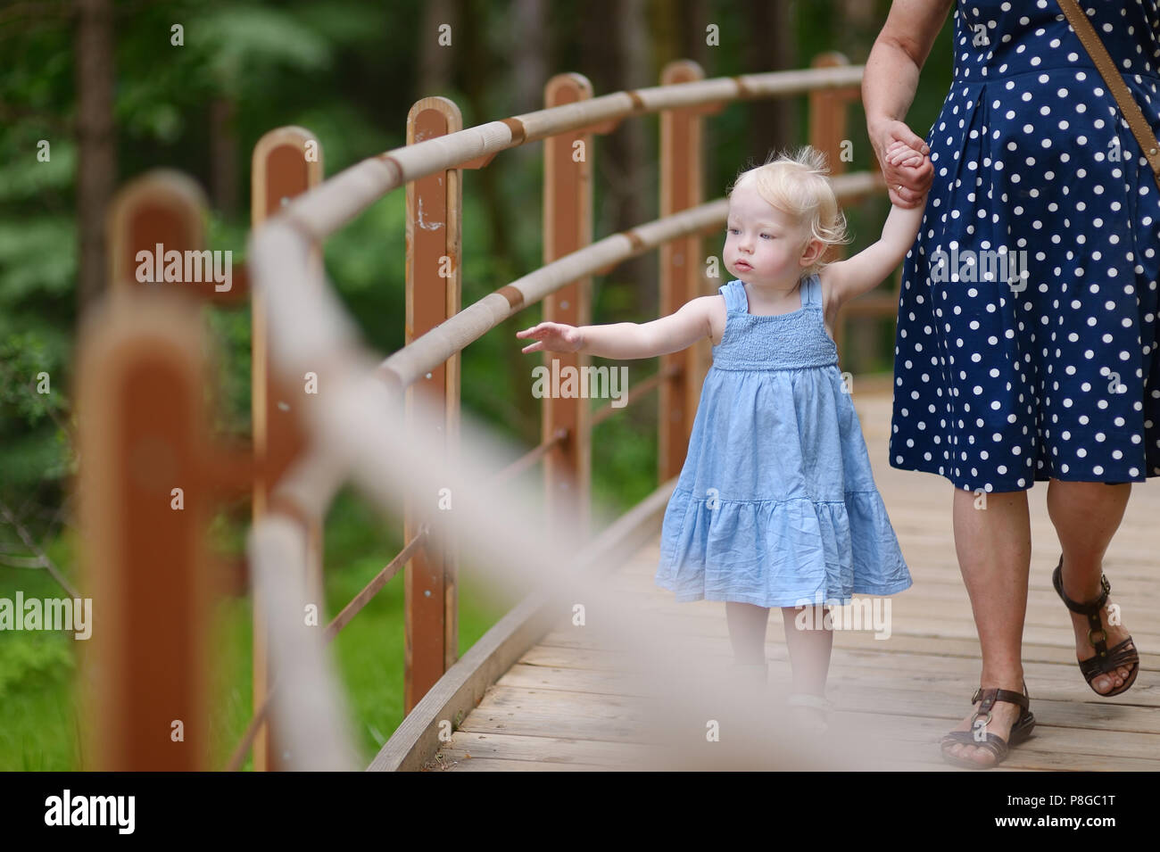 Toddler girl having a walk Stock Photo - Alamy