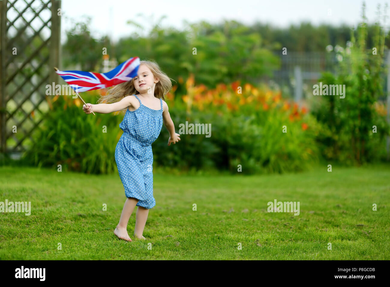 Adorable little girl with United Kingdom flag outdoors Stock Photo - Alamy