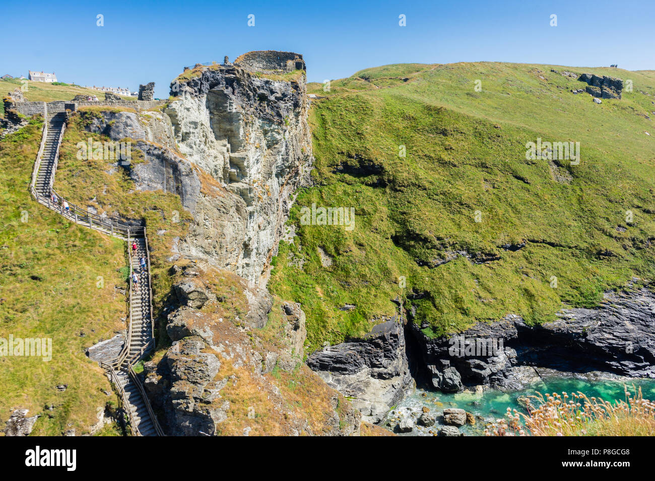 Tintagel Castle view from Tintagel Island with the South West Coast Path to the left, North ...
