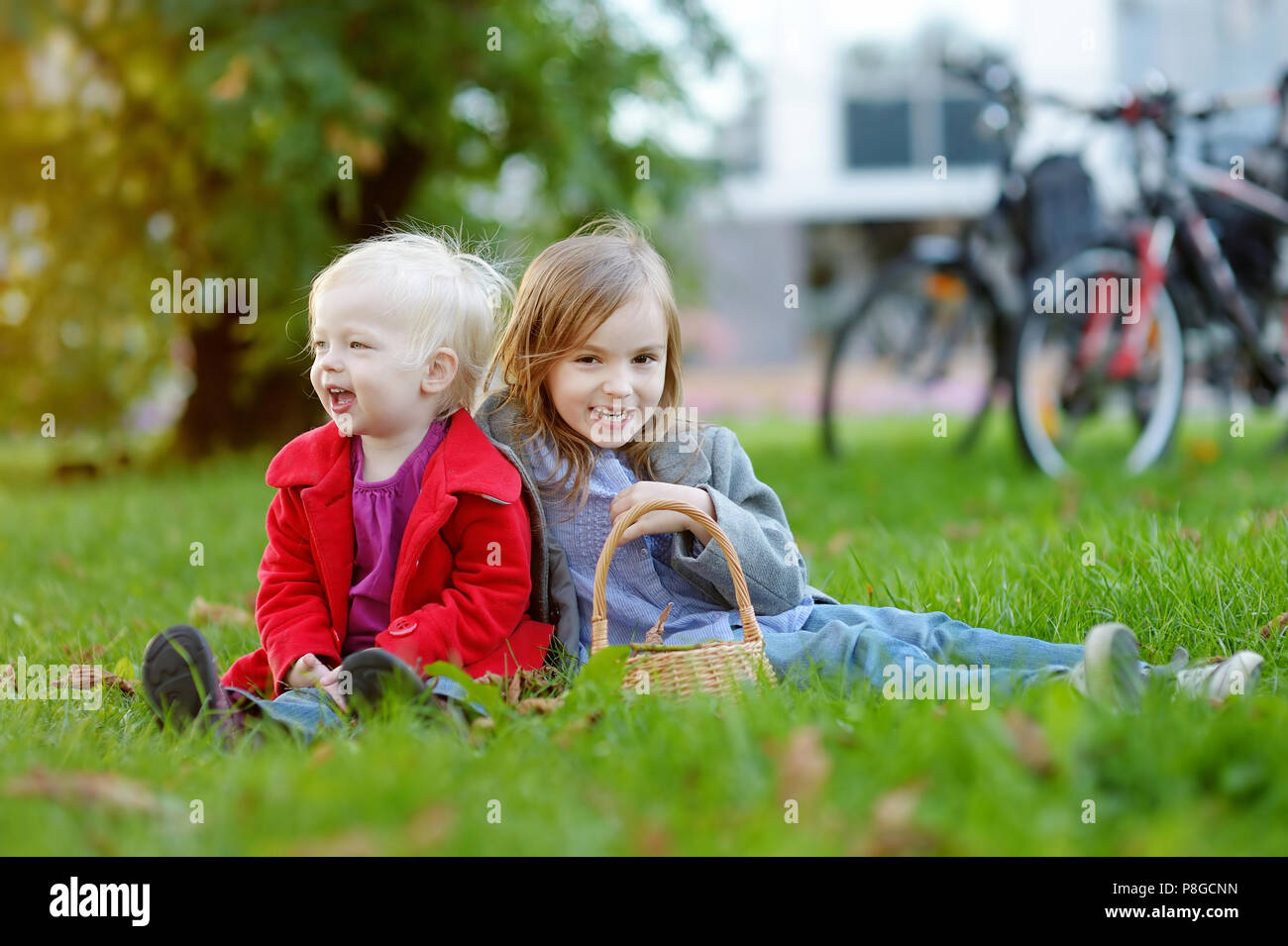 Two little sisters playing outside on a beautiful autumn day Stock ...