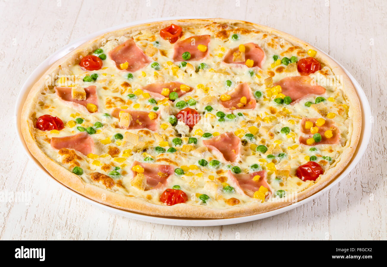 Pizza with ham and cheese Stock Photo - Alamy