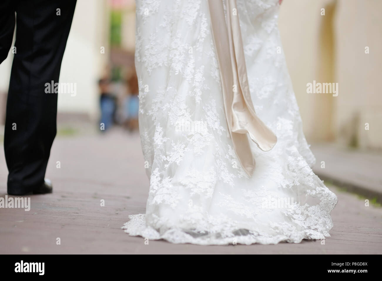 Bride and groom legs walking away Stock Photo - Alamy