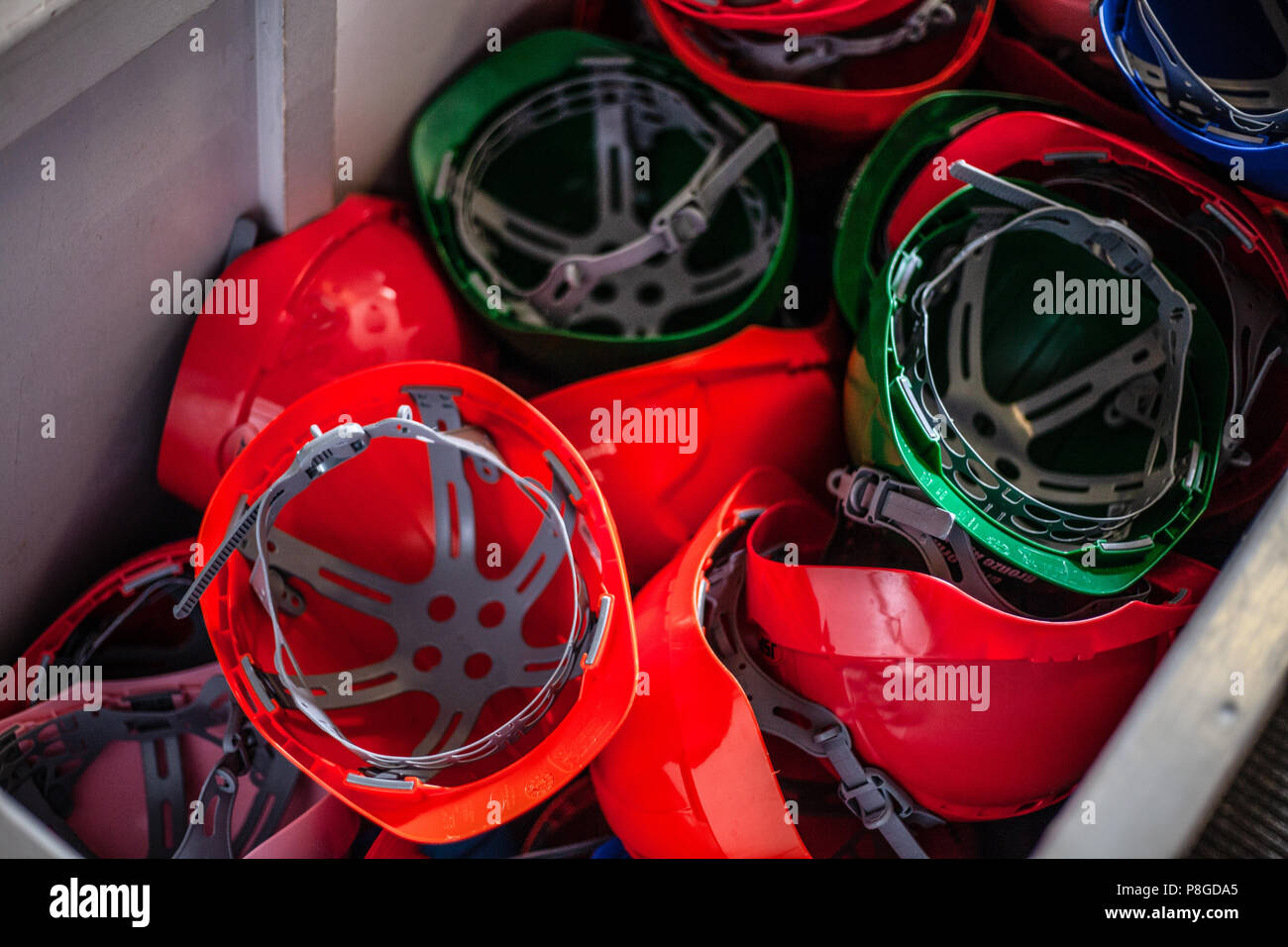 Storage of safety helmets. Safety helmets for construction site workers ...
