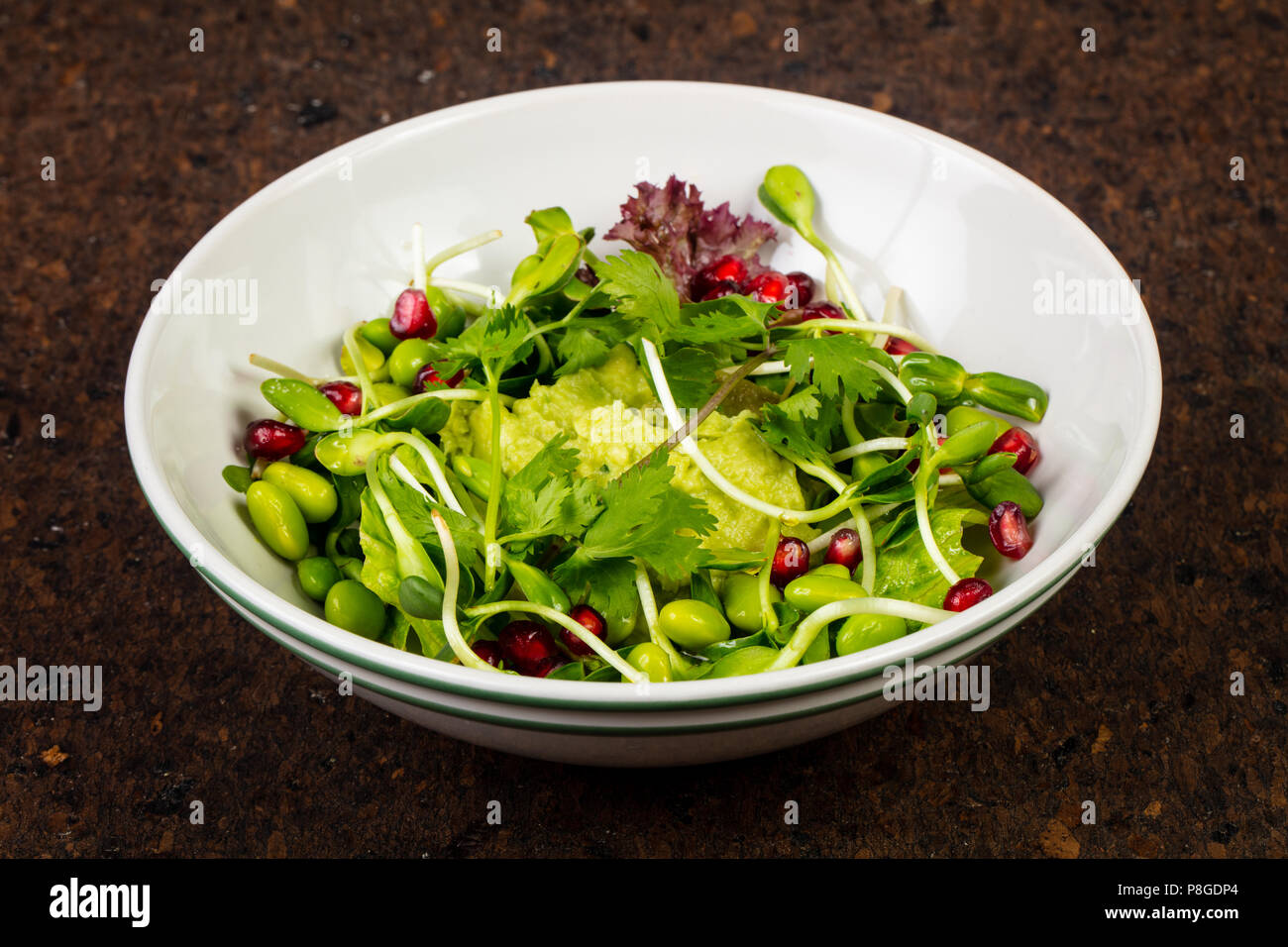 Delicious broad beans with sprouts,pomegranate and avocado pasta Stock ...