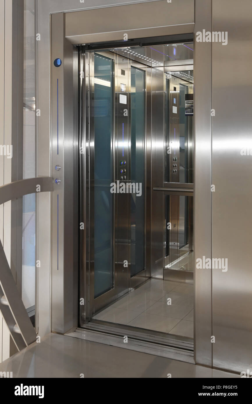 Contemporary stainless steel elevator in office building Stock Photo ...