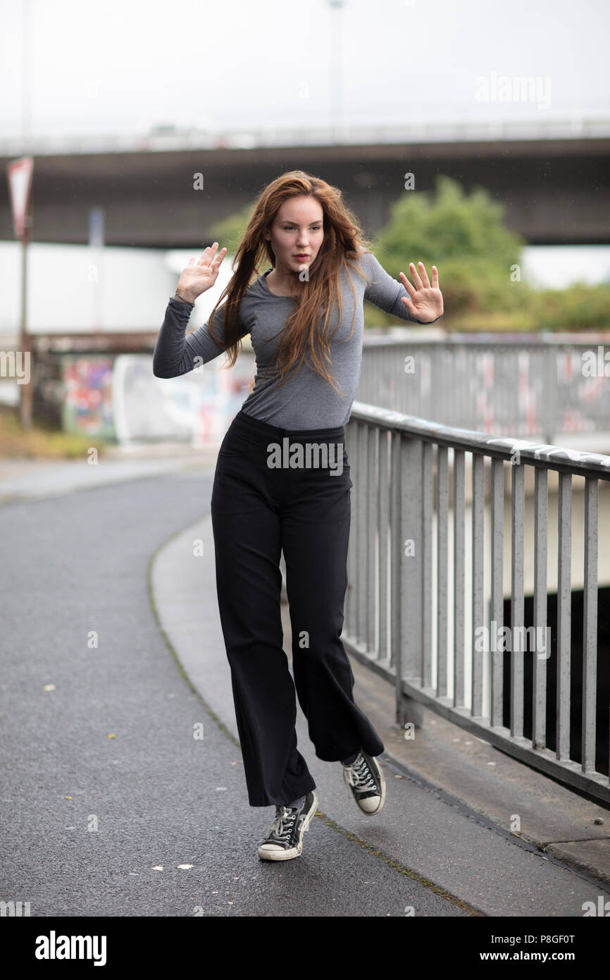 Female street dancer portrait in motion. Attractive young woman ...