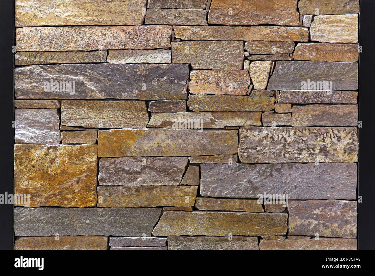 Close up shot of rough stone tiles wall Stock Photo - Alamy