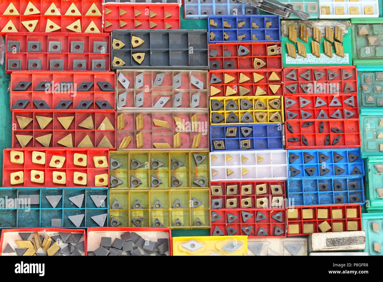Cemented carbide cutting tools in plastic boxes Stock Photo - Alamy