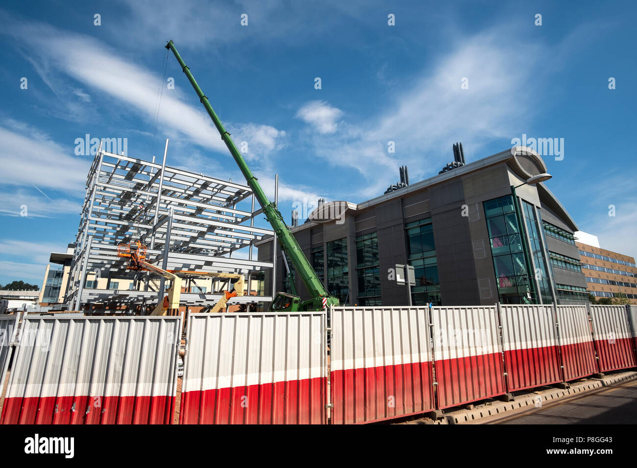 Building site fenced off at Nottingham University, UK Stock Photo - Alamy