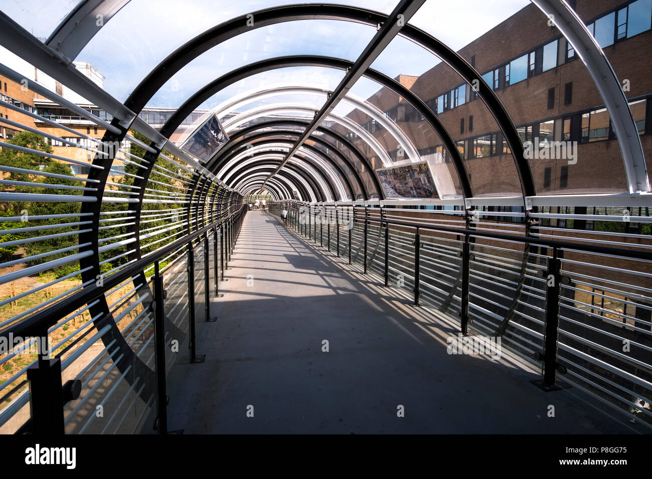 Modern pedestrian link bridge Stock Photo - Alamy