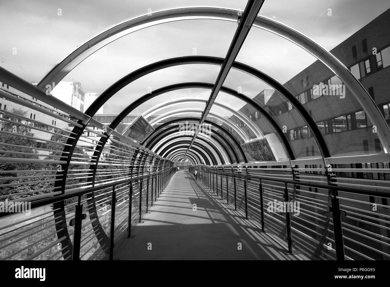 Modern pedestrian link bridge Stock Photo - Alamy