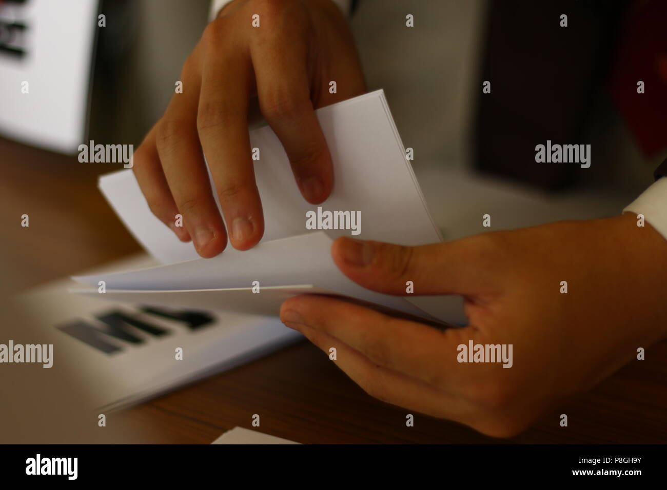Person flips through cards Stock Photo - Alamy