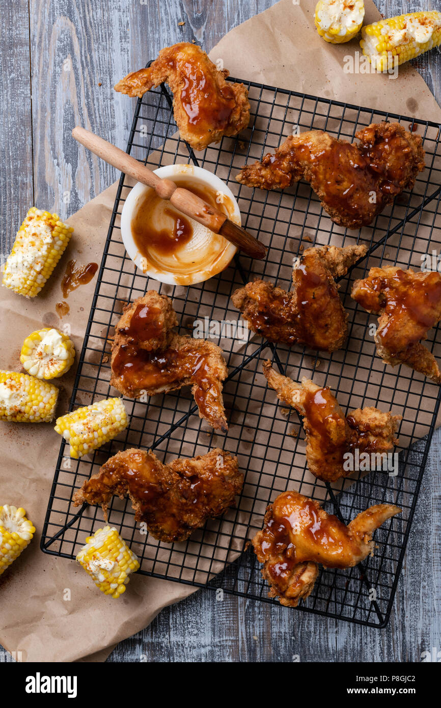 Fried Chicken wings with BBQ sauce and corn Stock Photo - Alamy