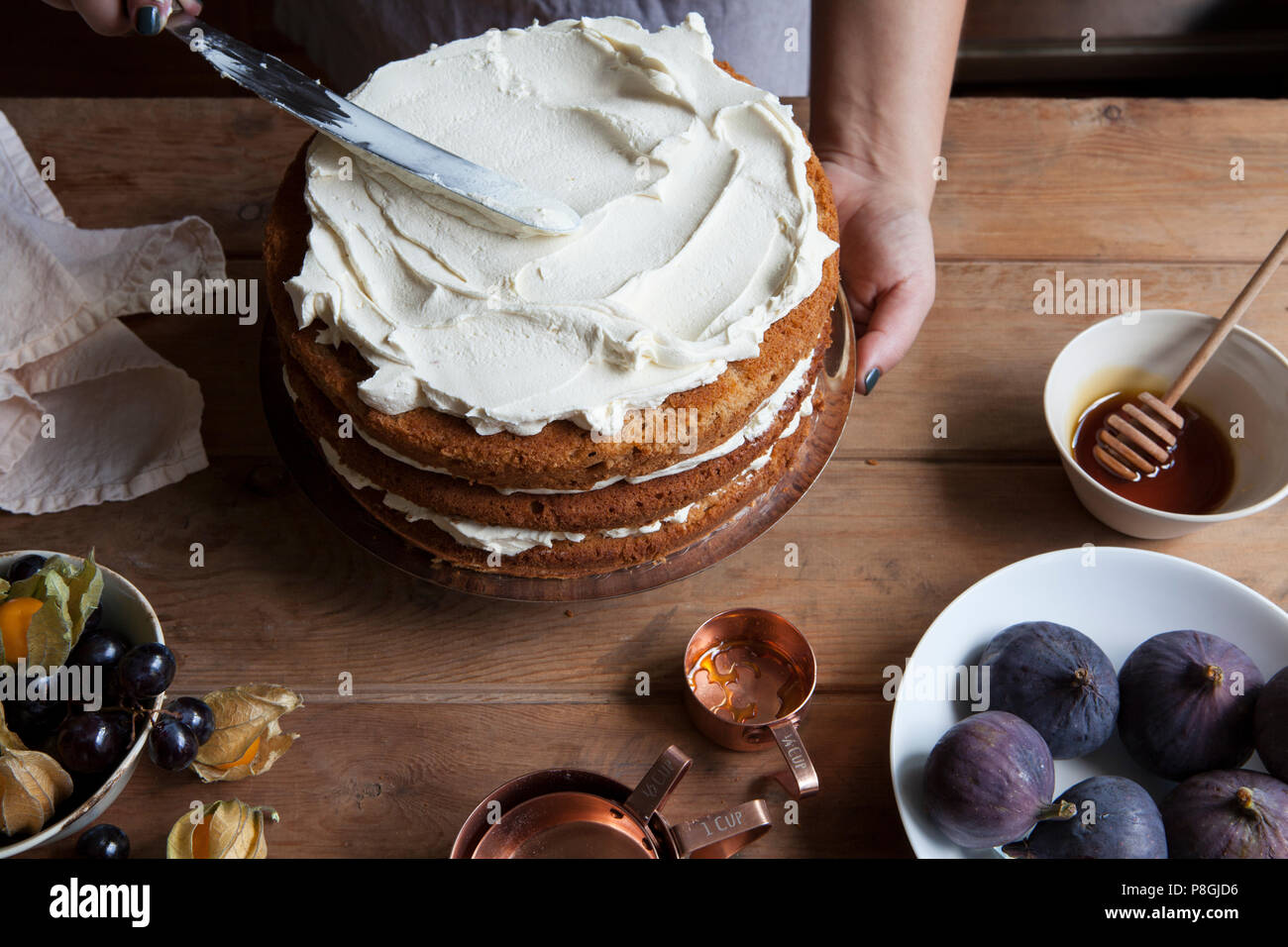 Hands Holding Cake With Icing High Resolution Stock Photography and ...
