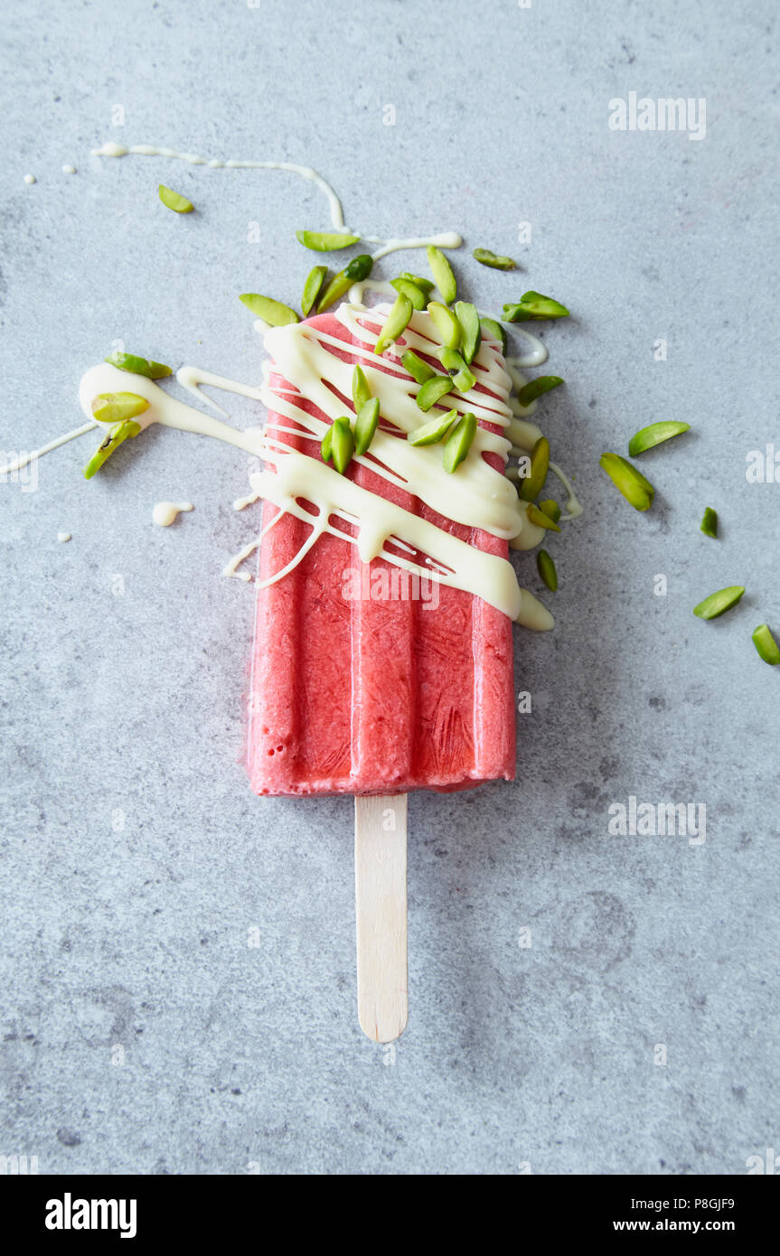 Strawberry Ice Lolly with white chocolate and pistachios Stock Photo ...
