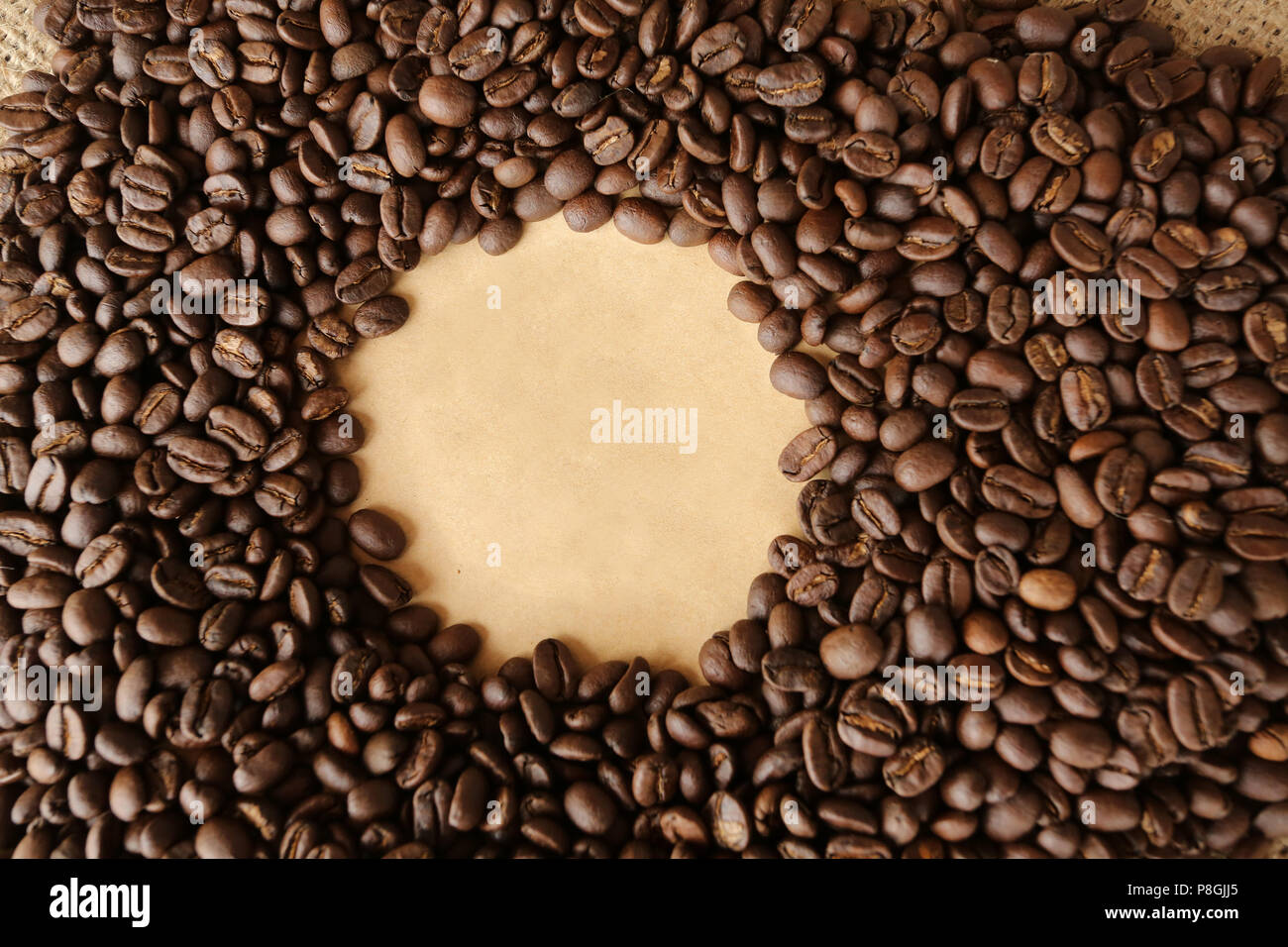 Coffee beans with a hole in the middle for a business logo or brand ...