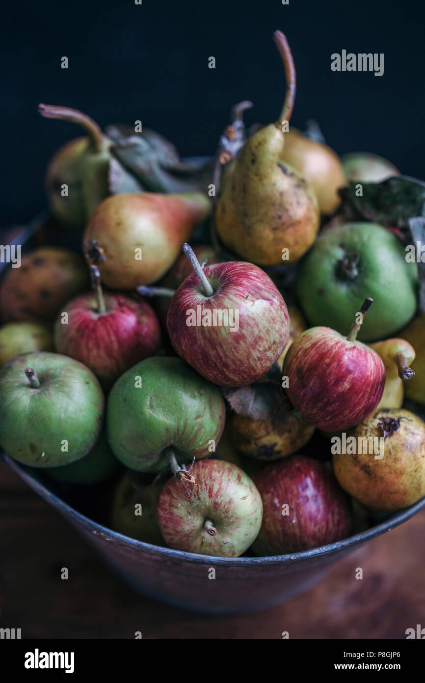 Organic apples and pears in a rustic bucket Stock Photo - Alamy