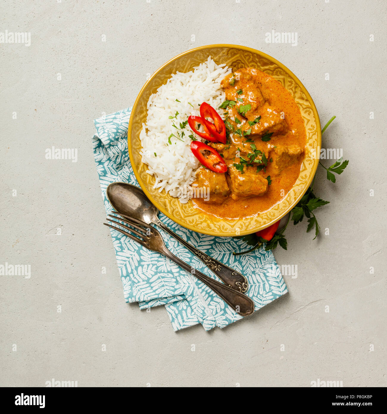 Traditional curry with rice on concrete background Stock Photo - Alamy