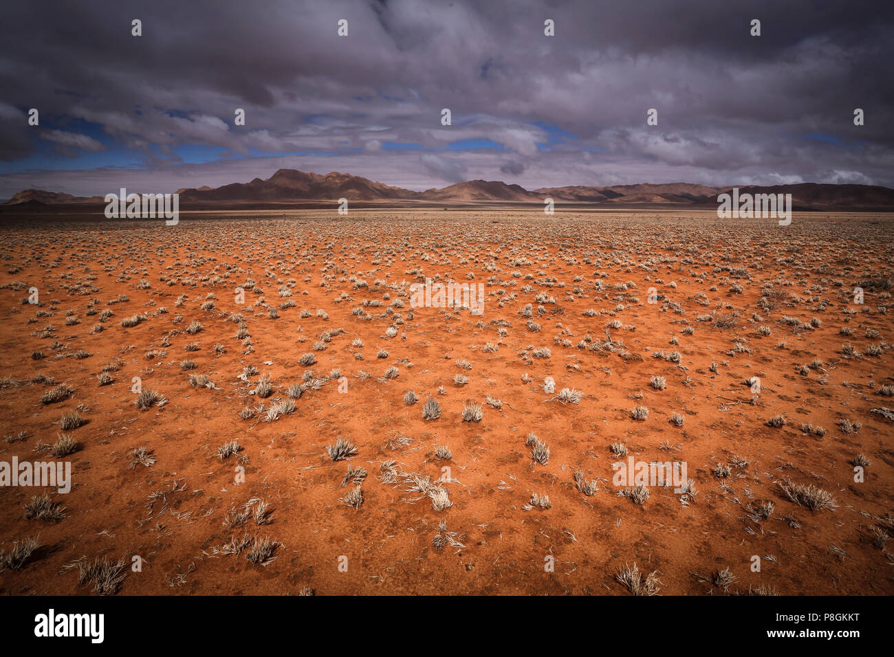 Dry landscape with clouds and mountains in the desert of Namibia Stock ...