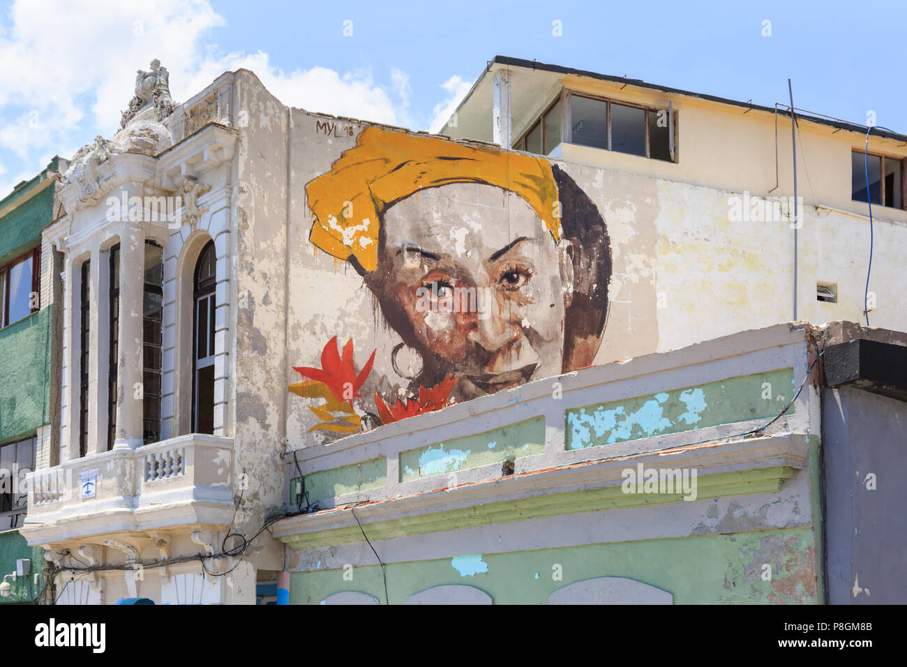 Painted wall with Cuban female face on a building in Havana, Cuba Stock ...