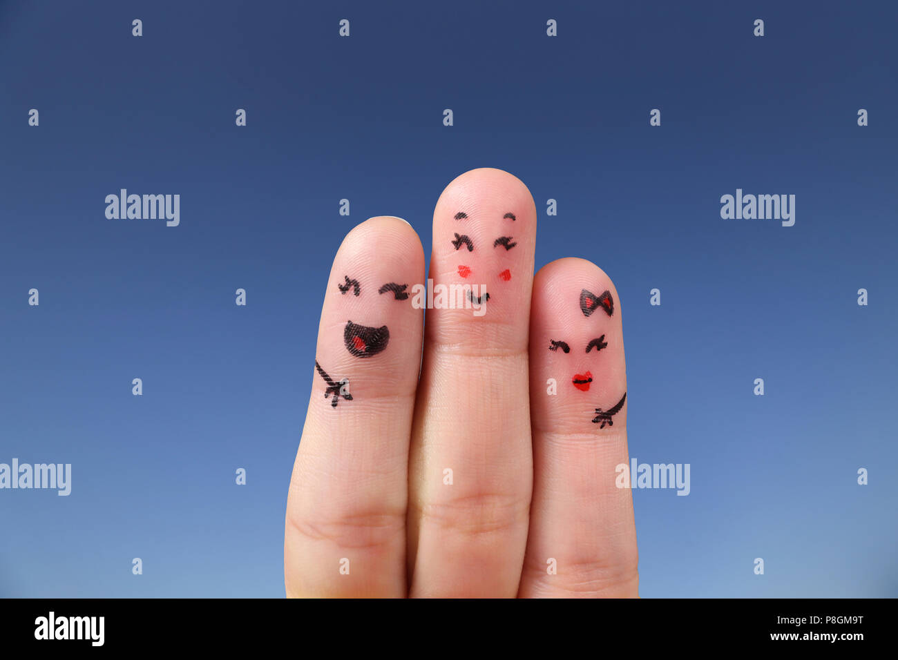 Finger puppet girl best friends with a blue sky Stock Photo - Alamy