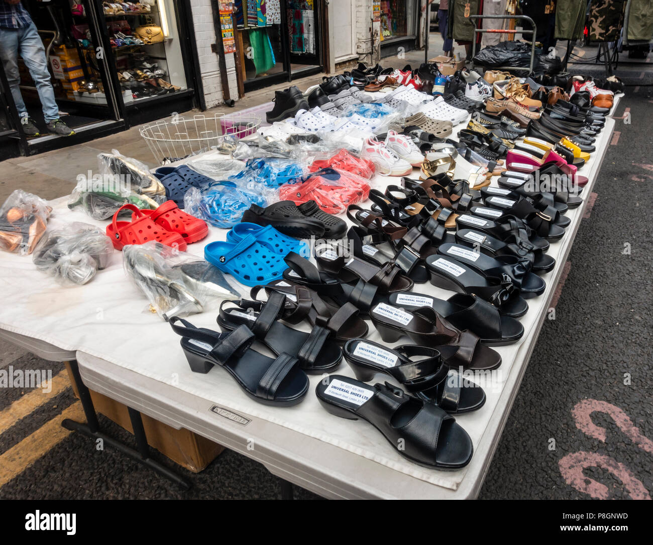 Shoes trainers market stall hi-res stock photography and images - Alamy