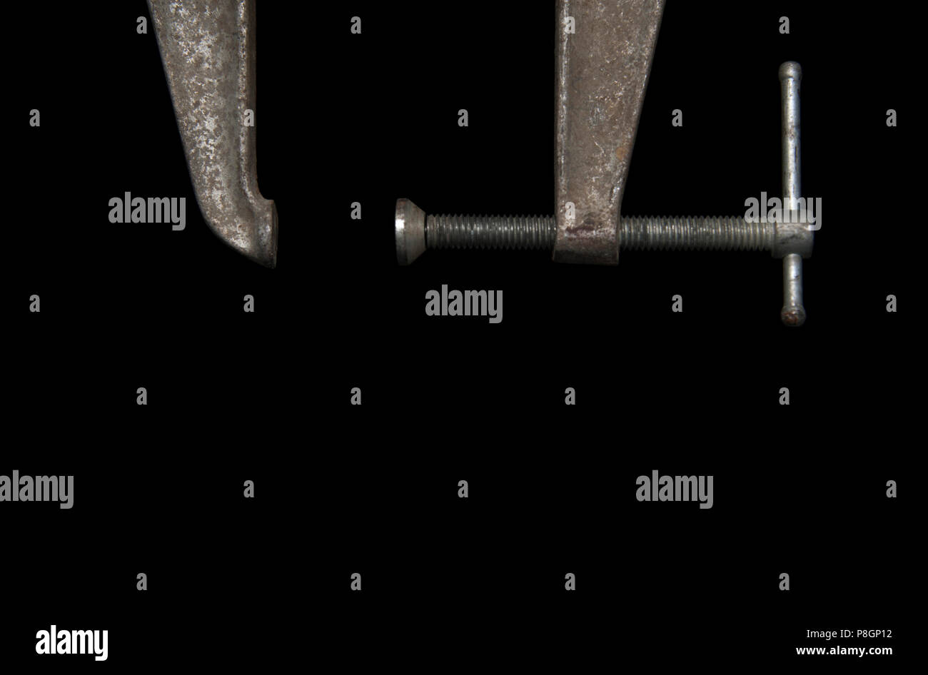 Old Rusted Silver C-Clamp Against A Black Background Stock Photo - Alamy