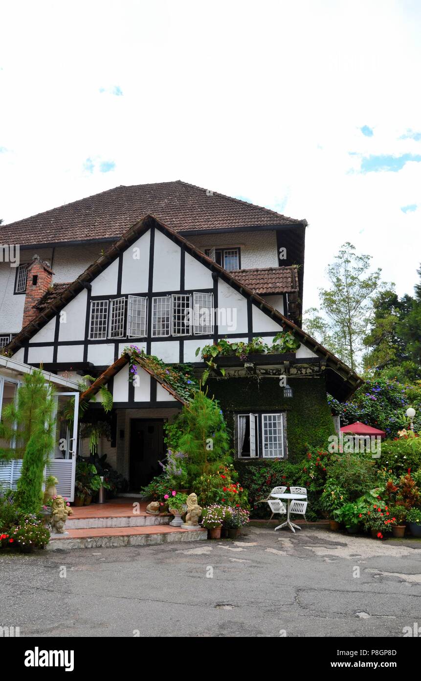 Main entrance to colonial era Tudor style bungalow cottage now a hotel ...