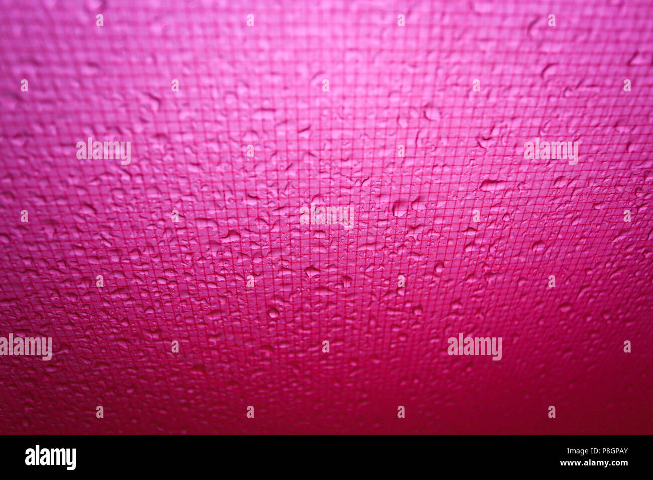Rain drops on the outside of a red tent's fly sheet Stock Photo - Alamy