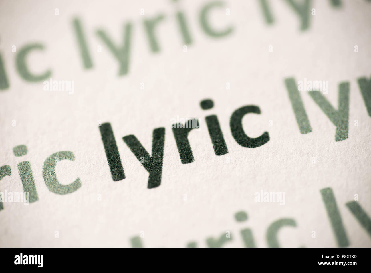 word lyric printed on white paper macro Stock Photo - Alamy