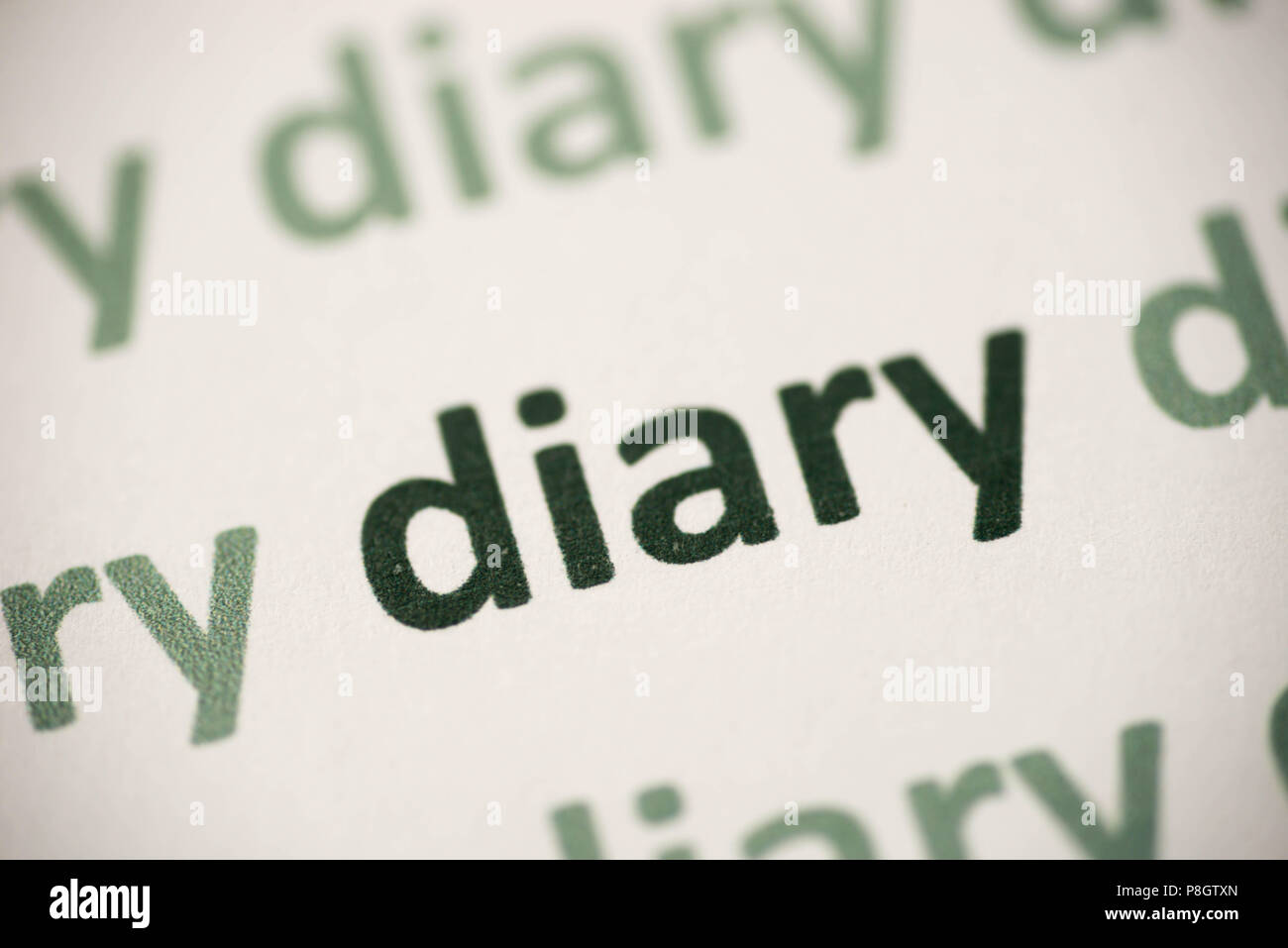 word diary printed on white paper macro Stock Photo - Alamy