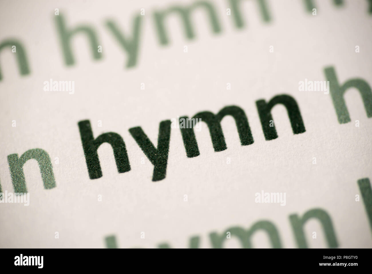 word hymn printed on white paper macro Stock Photo - Alamy