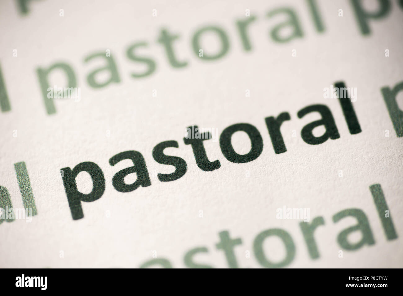 word pastoral printed on white paper macro Stock Photo - Alamy
