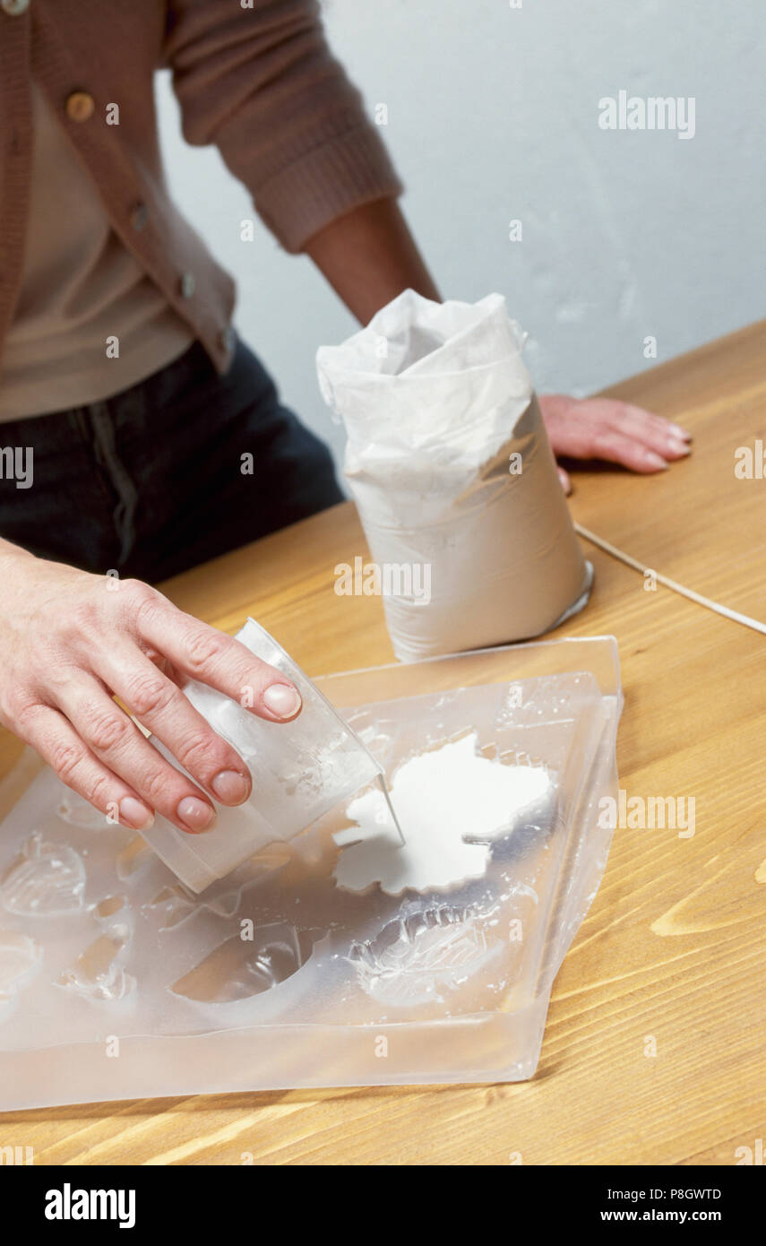 Woman mixing plaster FOR EDITORIAL USE ONLY Stock Photo - Alamy