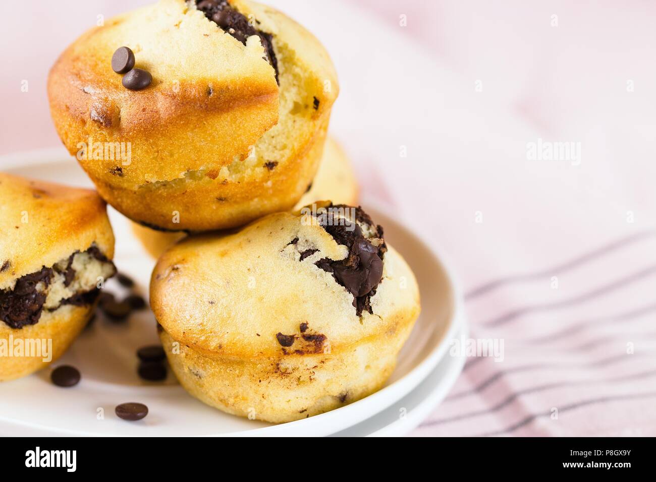 A pile of homemade muffins with dark chocolate chunks Stock Photo - Alamy