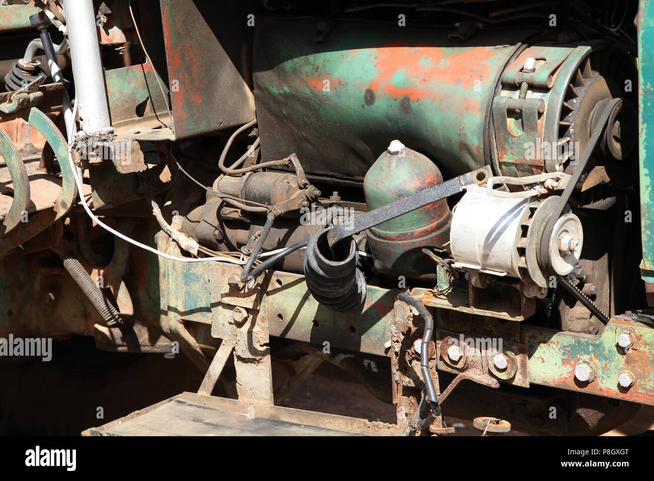 Old tractor engine with many modifications. Rusty, but working. Old ...