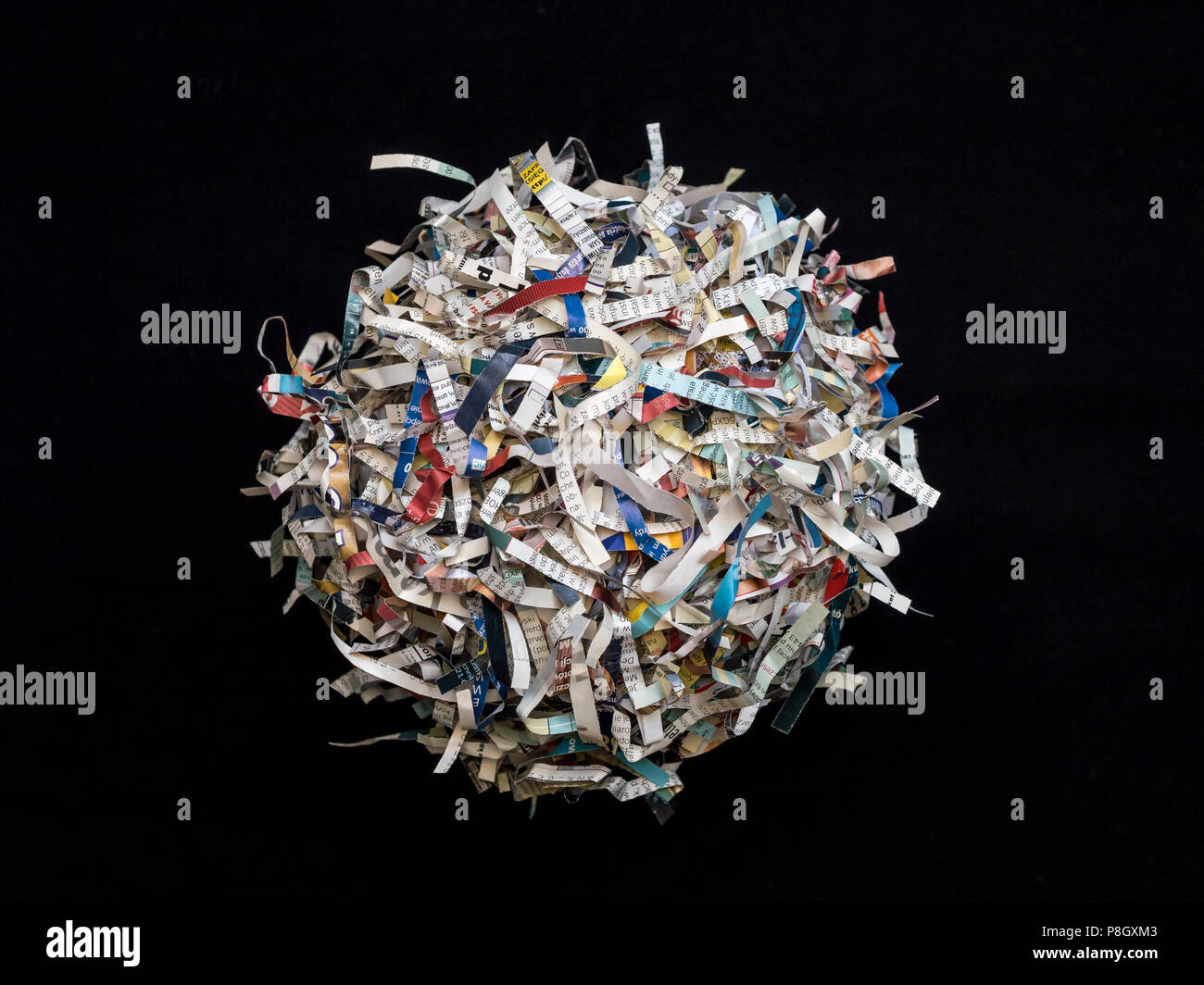 Shredded paper cuttings formed into sphere on black background Stock ...