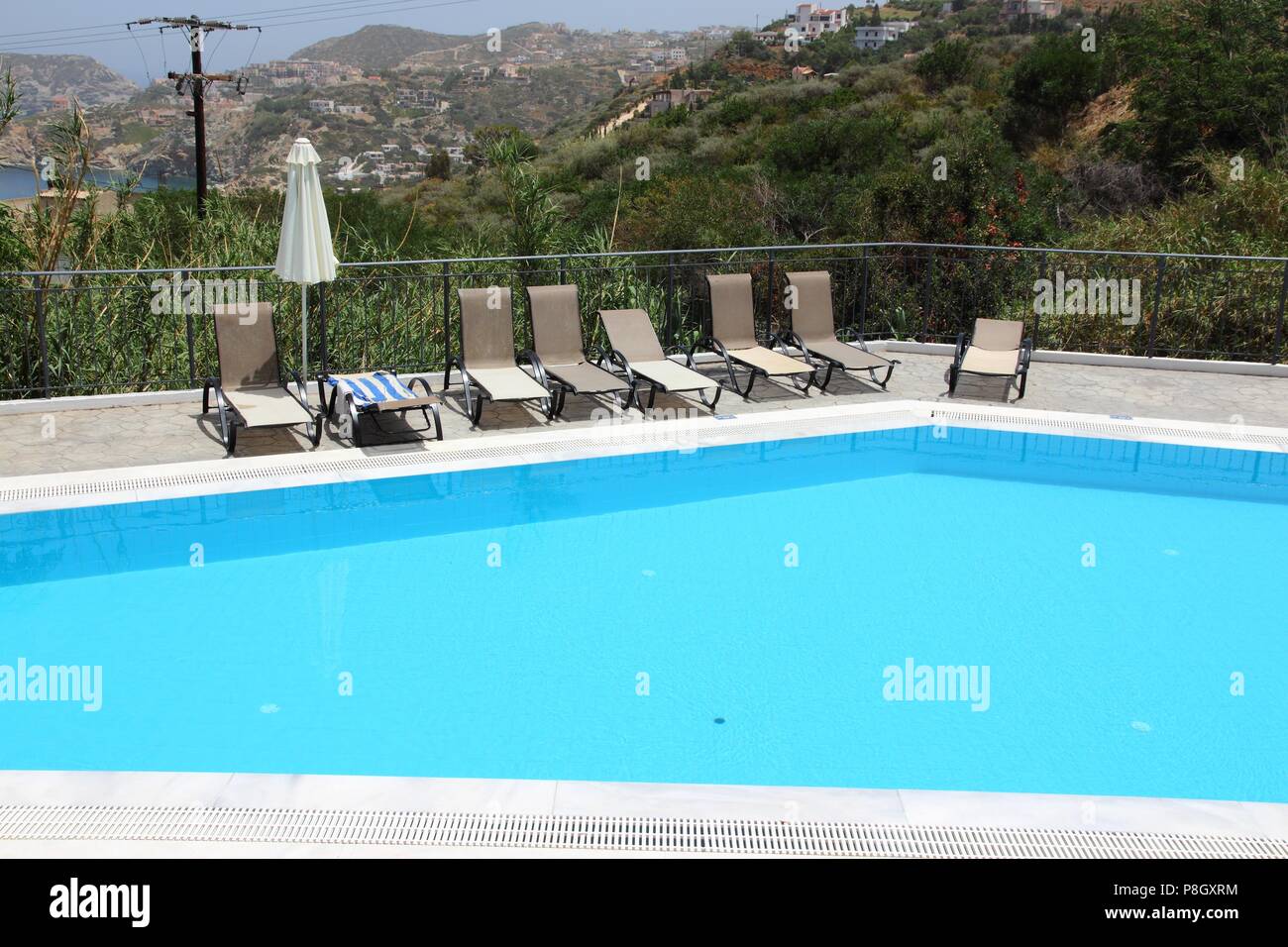 Generic vacation resort in Crete island in Greece. Swimming pool sun ...