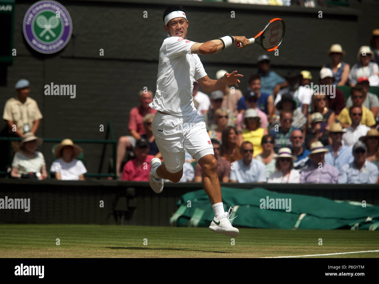 Kei nishikori competing at wimbledon hi-res stock photography and ...
