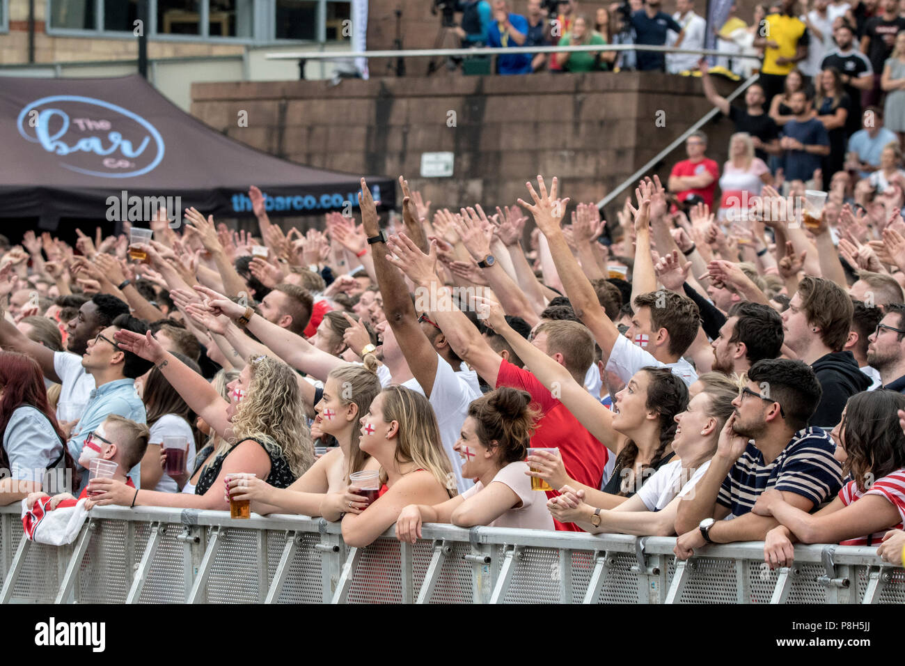 Castlefield Bowl, Manchester, UK. 11th July 2018. Football fans sing ...