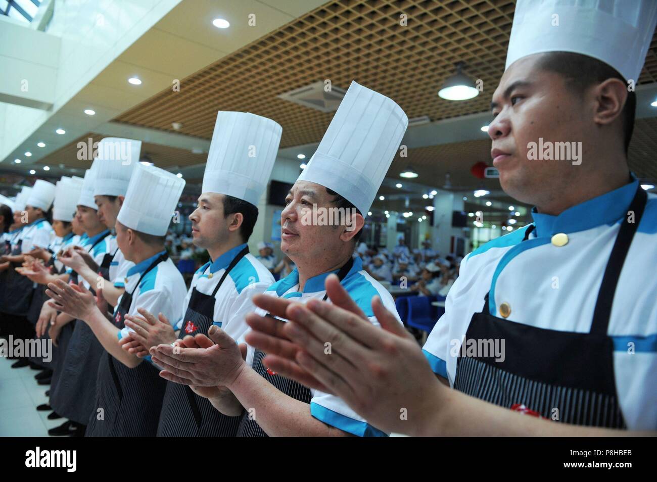 Qingdao, Qingdao, China. 12th July, 2018. Qingdao, CHINA-A cooking ...