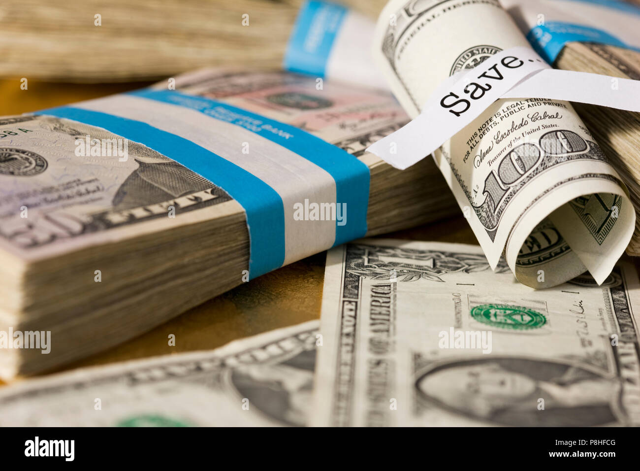 pile of dollar currency on a table Stock Photo - Alamy