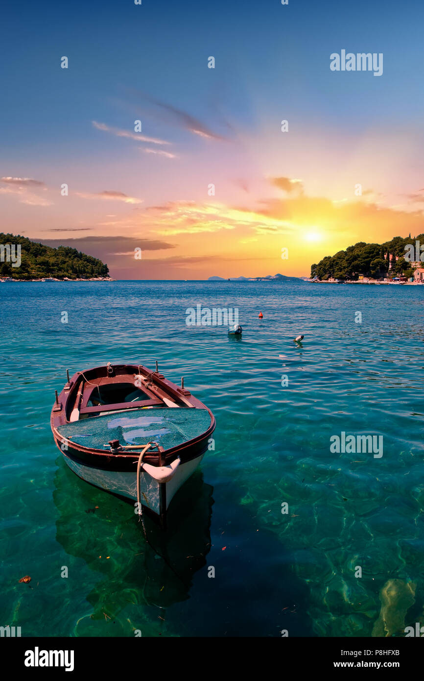 Blue Boat on Blue Water Stock Photo - Alamy