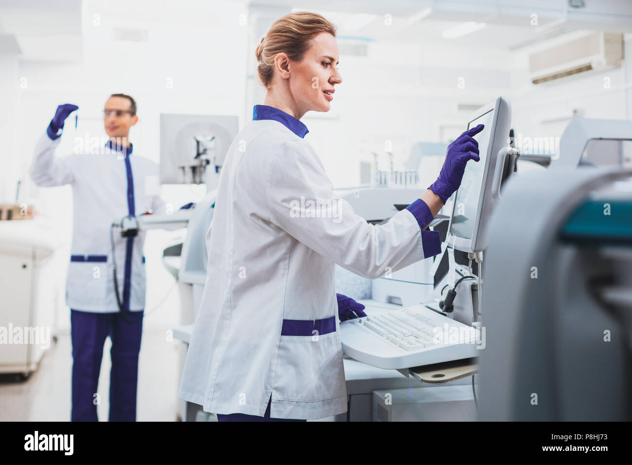 Scientists using modern computer technology hi-res stock photography ...