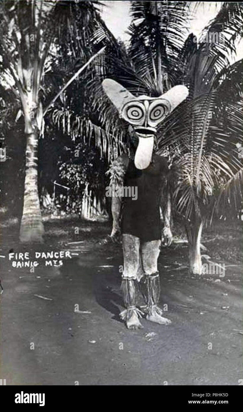 A Baining fire dancer wearing ceremonial mask, New Britain Stock Photo ...