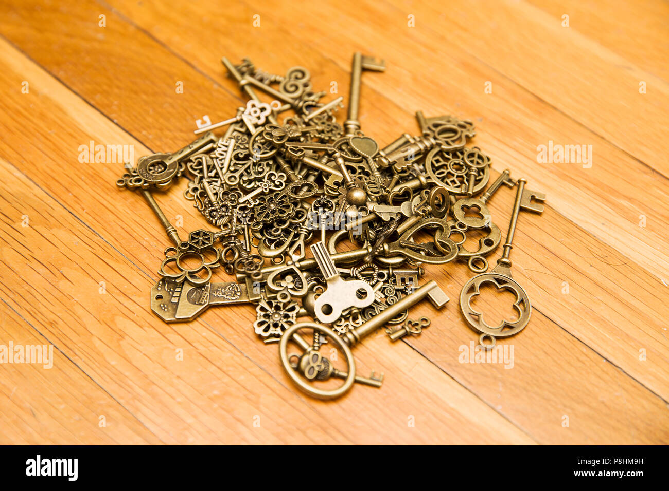 A pile of vintage keys on the table Stock Photo - Alamy